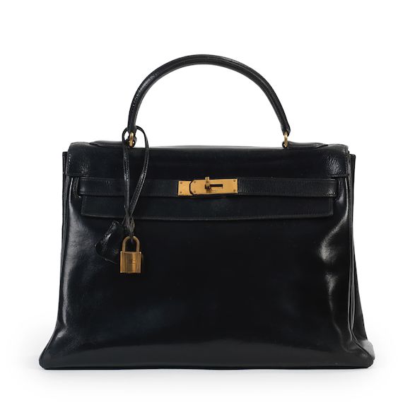Bonhams : Hermès: a Black Box Leather Retourne Kelly 32 1960s (includes ...