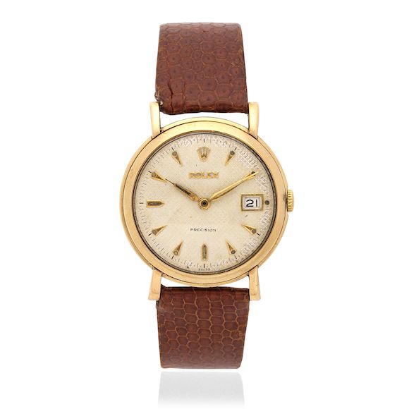 Bonhams : Rolex. A 9K gold manual wind wristwatch with roulette date ...