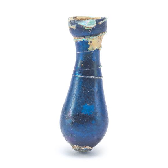 Bonhams : A miniature Roman blue glass unguentarium