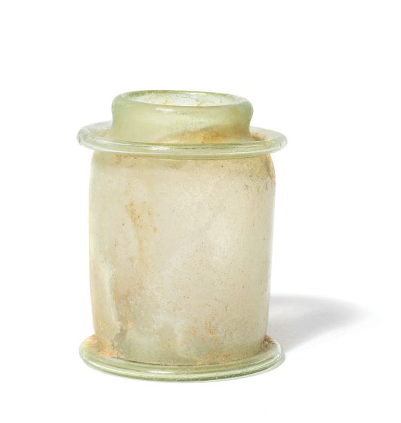 Bonhams : A Roman light green small glass pyxis