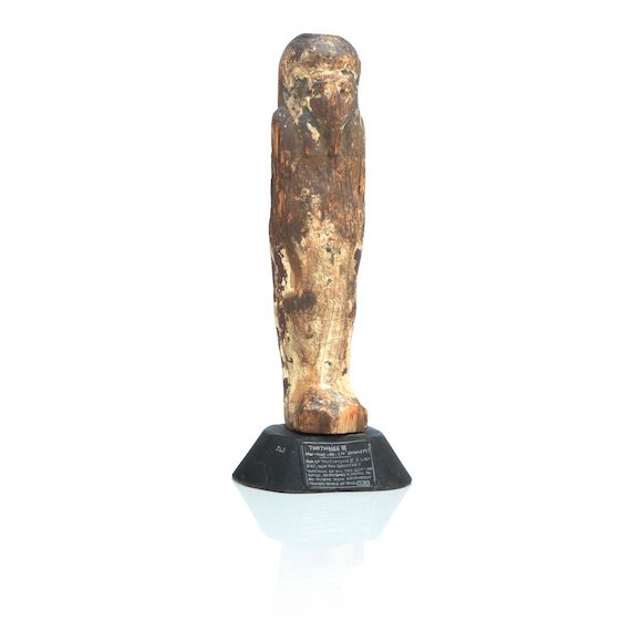 Bonhams : An ancient Egyptian carved wooden figure