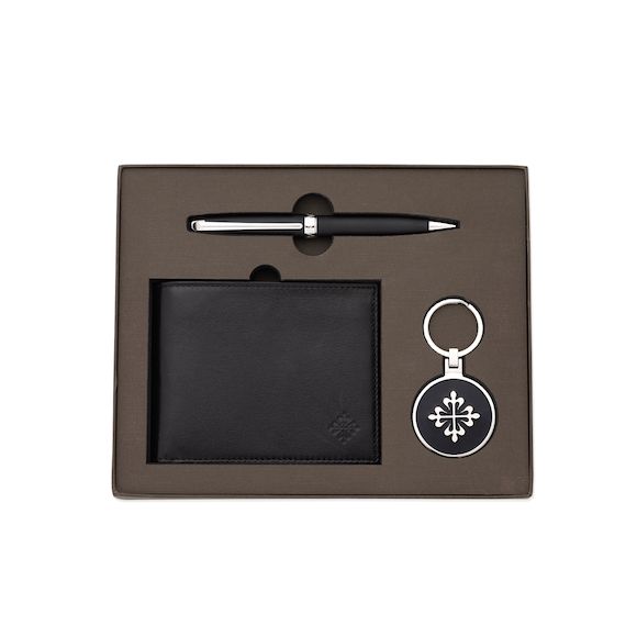 Bonhams : Patek Philippe. A wallet, pen and key ring set Circa 2010
