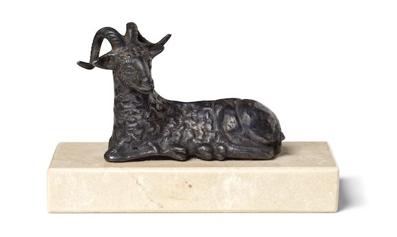 Bonhams : An Achaemenid silver alloy recumbent horned goat