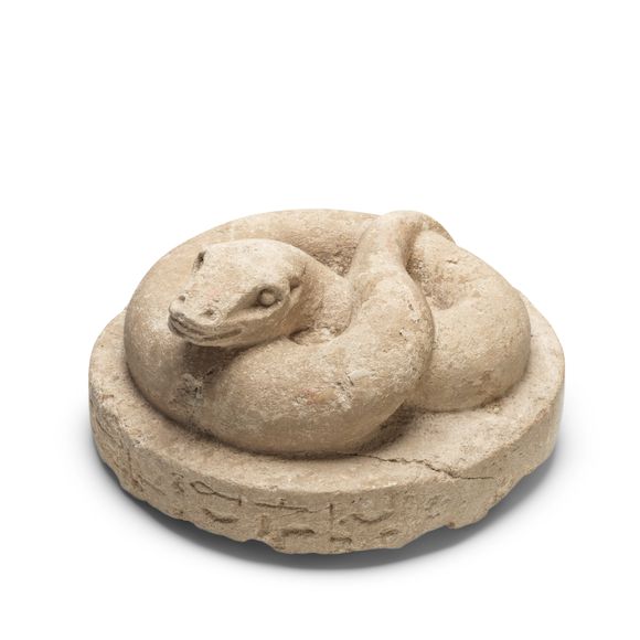 Bonhams : An Egyptian limestone snake