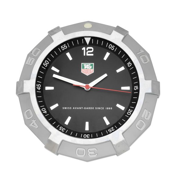 Bonhams : TAG Heuer. A plastic and stainless steel wall clock Circa 2010