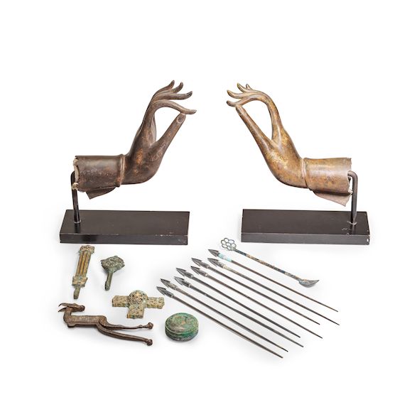 Bonhams : A COLLECTION OF BRONZE BUDDHIST HANDS, ARROWS AND OTHER ITEMS ...