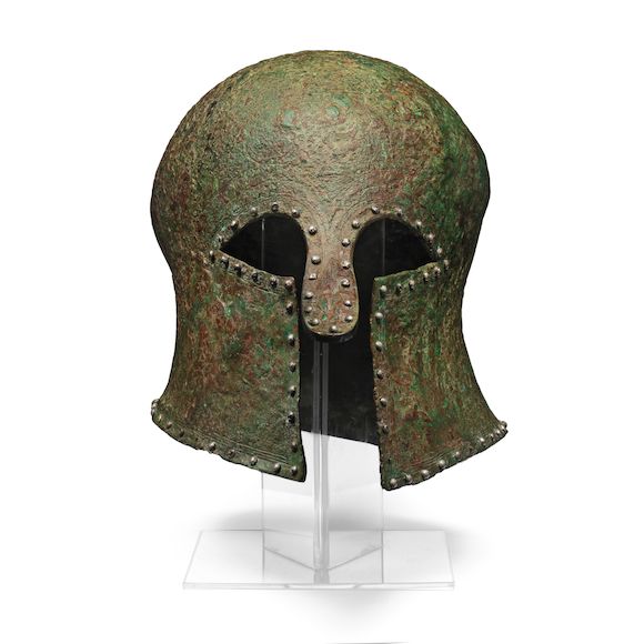 Bonhams : A Greek bronze Corinthian helmet with silver rivets