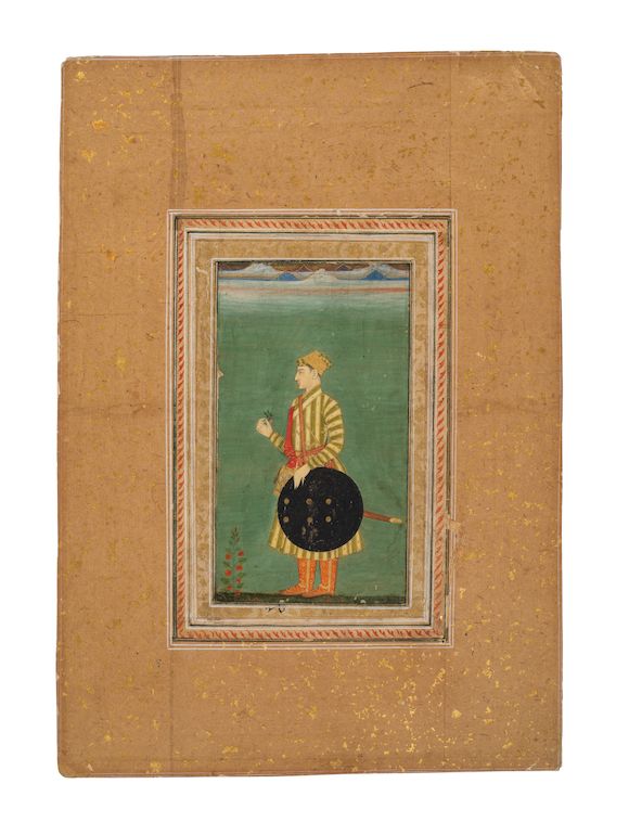 Bonhams : An officer holding a flower and armed with a katar, a sword ...