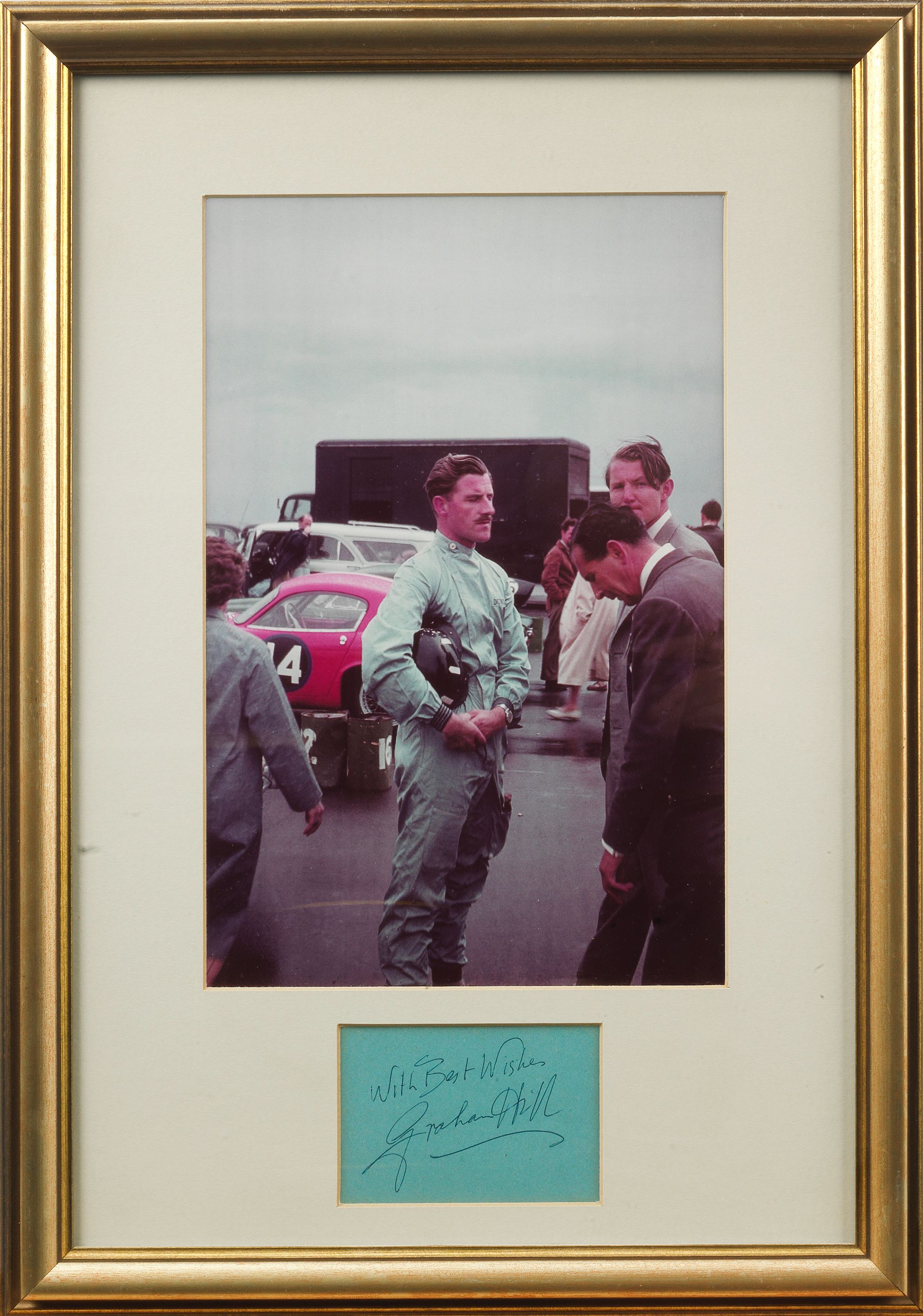 Bonhams Cars : A framed photograph of Graham Hill, with signature,