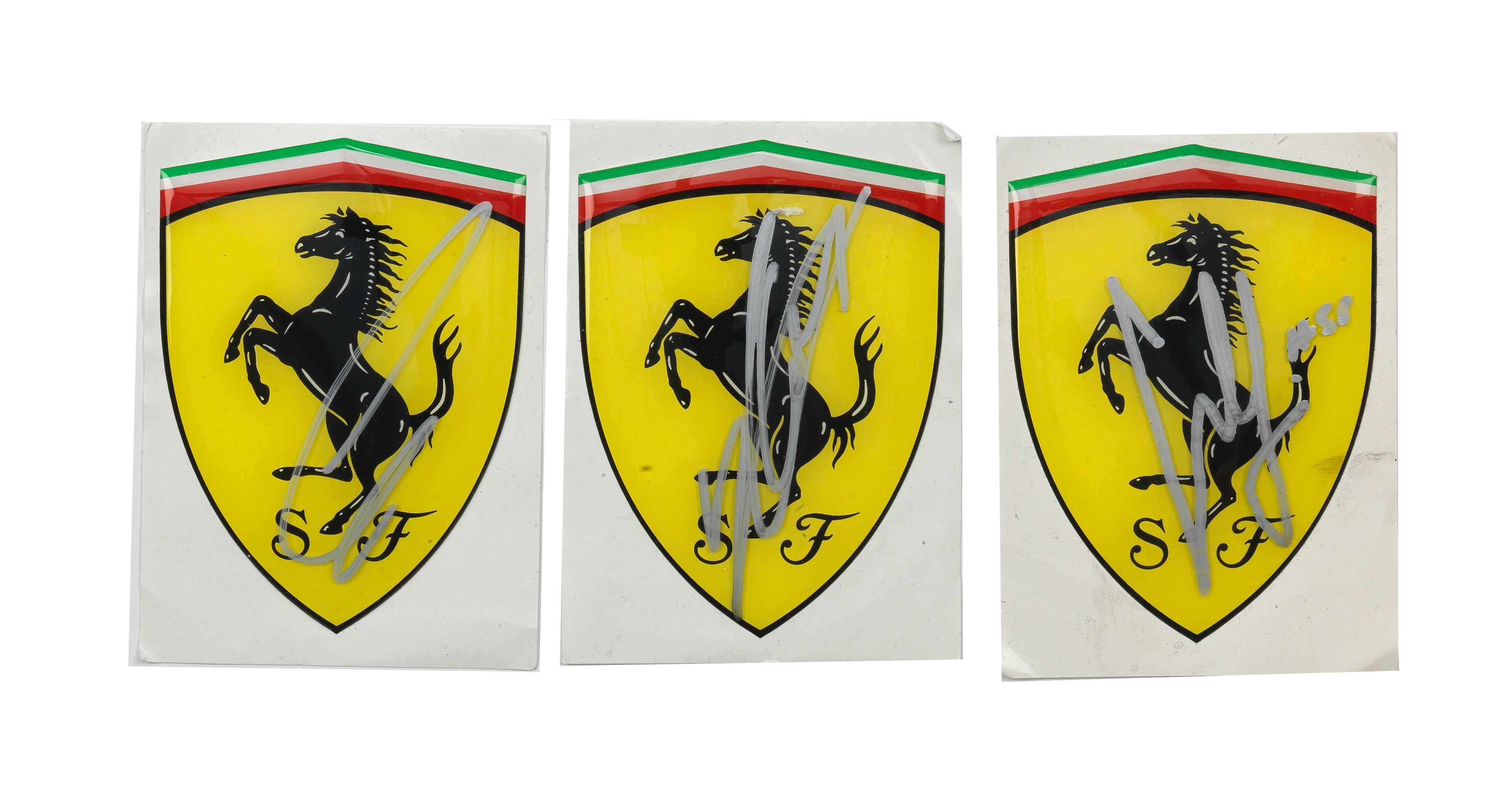 Bonhams Cars : Three signed Ferrari gel badge emblems, ((3))