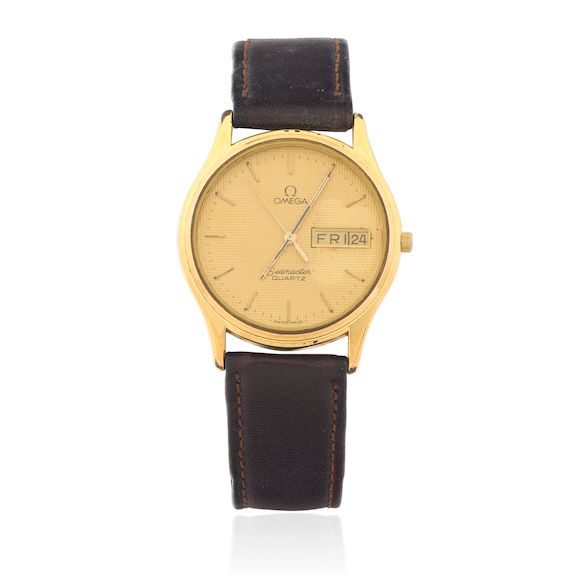 Bonhams : Omega. A gold plated quartz calendar wristwatch with Emblem ...