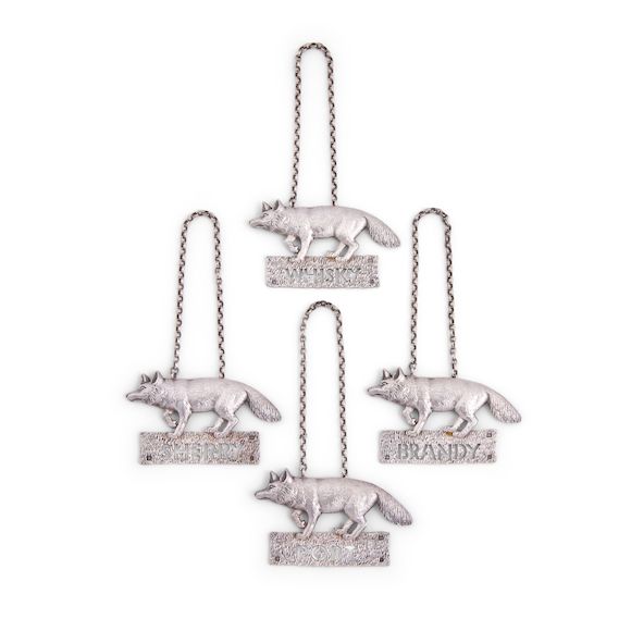 Bonhams : A set of four silver decanter labels Mappin & Webb, London 1976