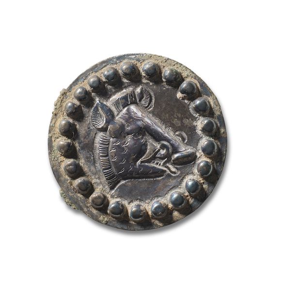 Bonhams : A Roman silver phalera with boar's head