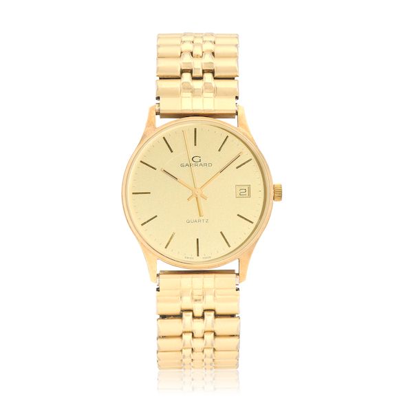 Bonhams : Garrard. A 9K gold quartz calendar bracelet watch Birmingham ...