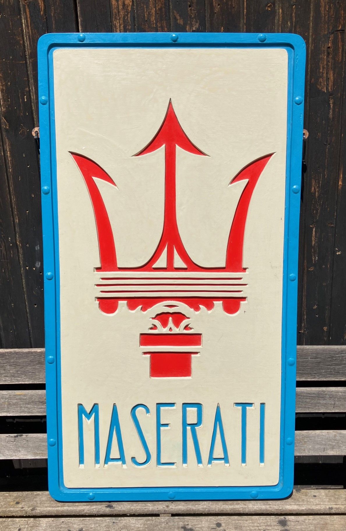 Bonhams Cars : A 'Maserati' garage display emblem,