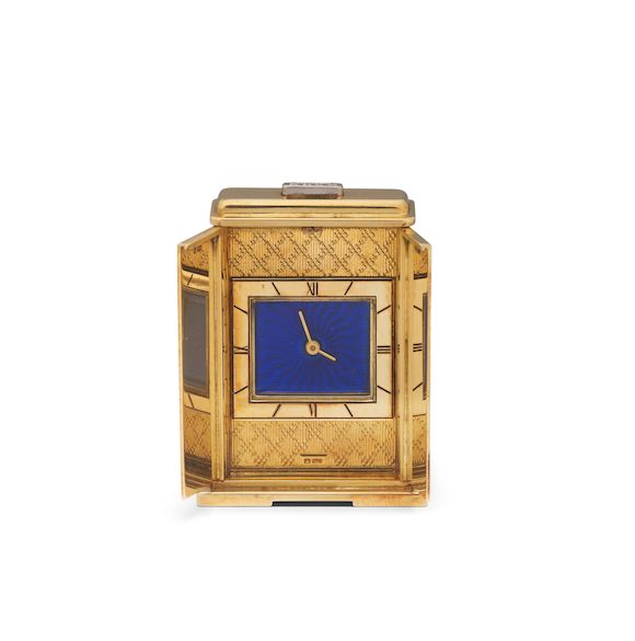 Bonhams : A late 20th century diamond set 18K gold quartz travel clock ...