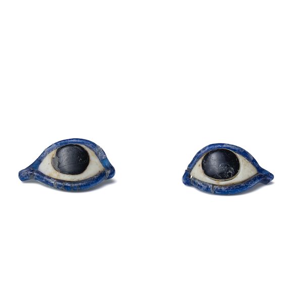 Bonhams : A pair of Egyptian glass eye inlays with translucent blue eye ...