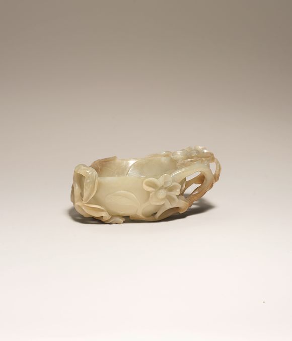 Bonhams : A LARGE PALE GREEN AND RUSSET JADE 'MAGNOLIA' BRUSHWASHER ...