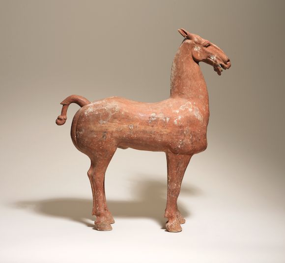 Bonhams : A LARGE RED-PAINTED POTTERY FIGURE OF A STANDING HORSE ...
