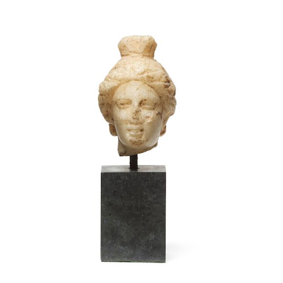 Bonhams : A small Hellenistic marble head of Tyche