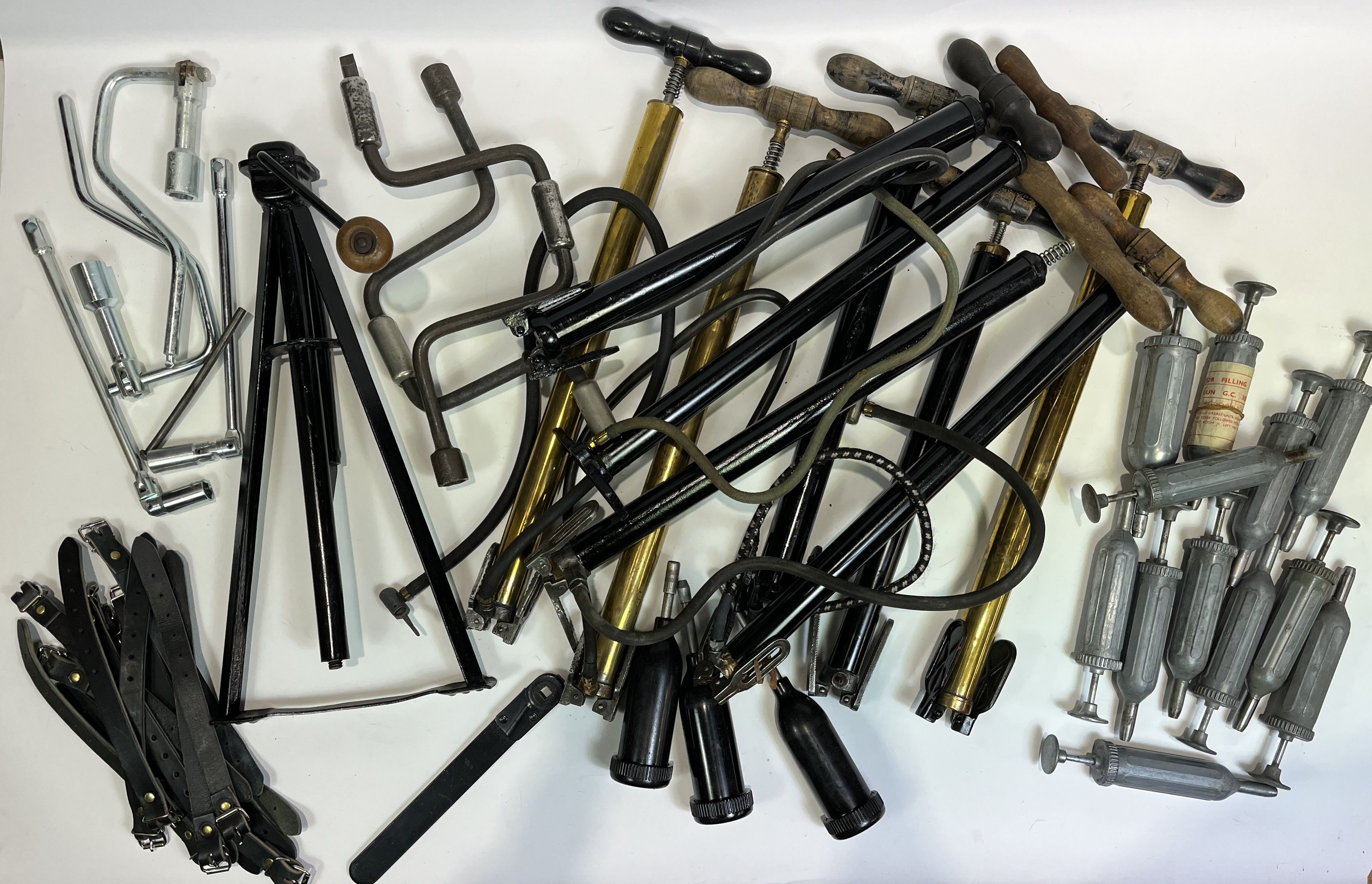 Bonhams Cars : Grease guns, cranks, leather straps, jacks, air pumps...