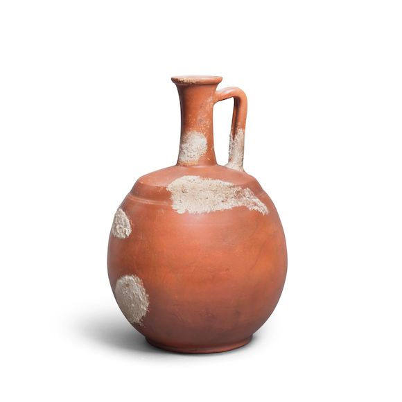 Bonhams : A Roman-style red slip ware jug