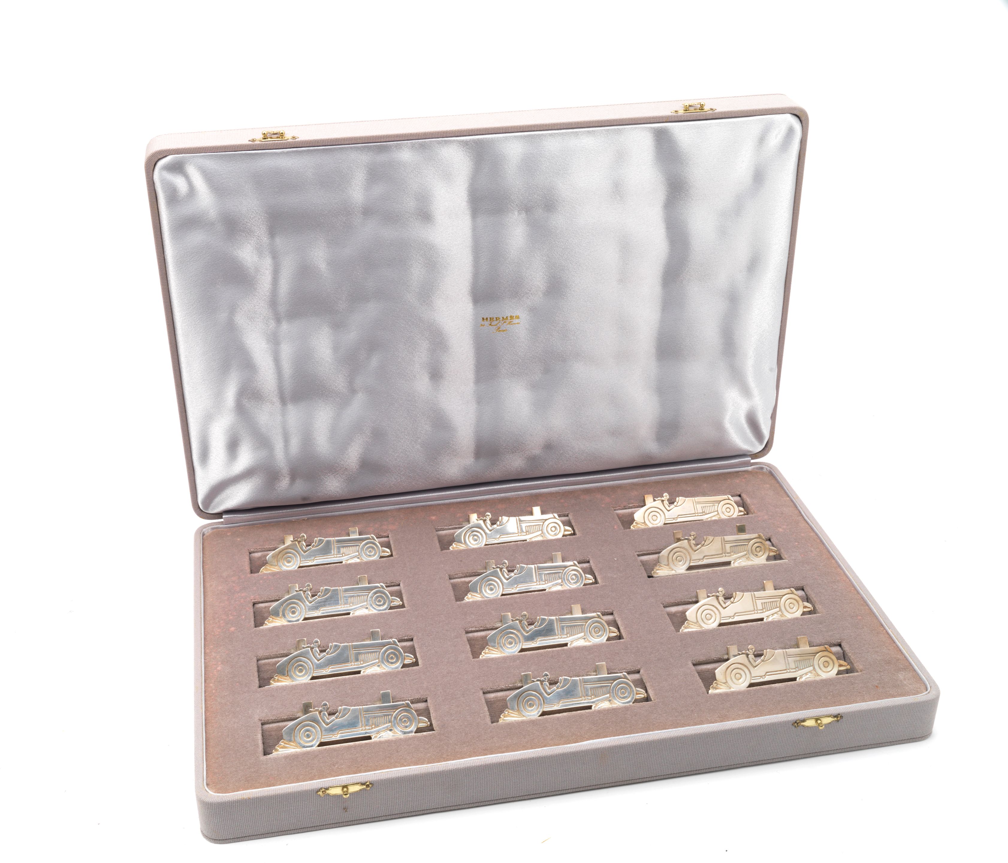 Bonhams Cars : A cased set of 12 silver motoring-themed place card ...
