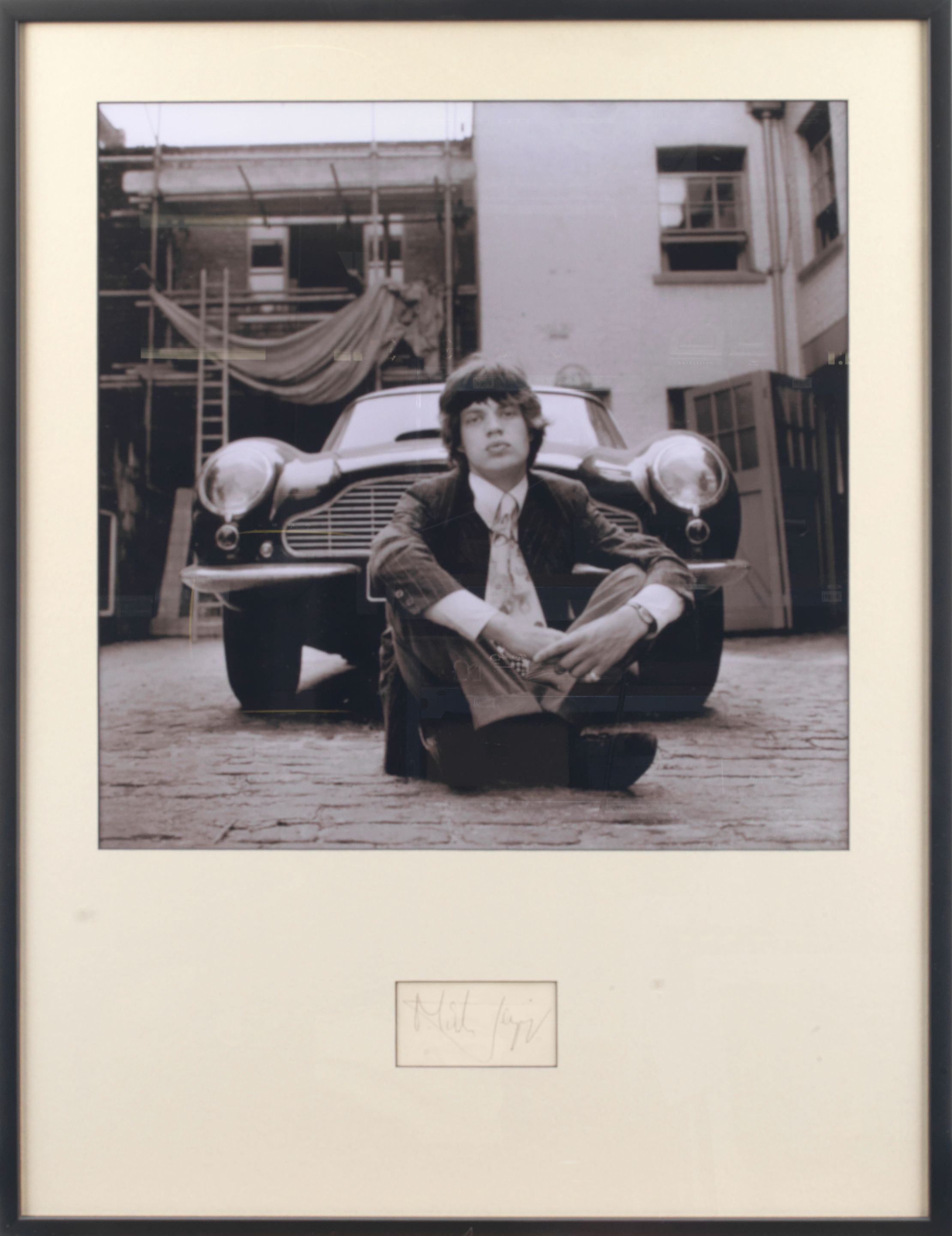 Bonhams Cars : A monochrome photograph of Mick Jagger and his Aston ...